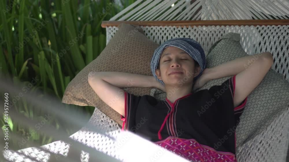 Relax ethnic hill tribe girl napping on hammock after morning work ...