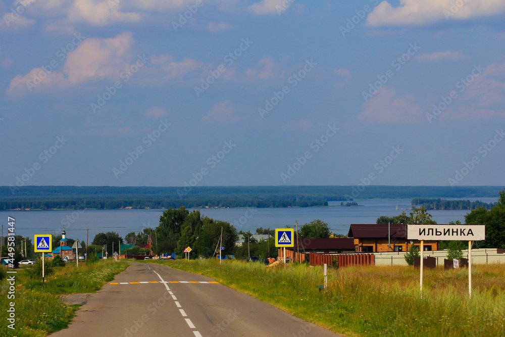 The road in the village, going towards the Volga, with a sign of the ...