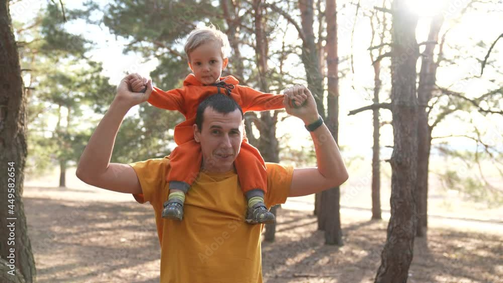 father and son in the park. happy family piggyback a kid dream concept ...