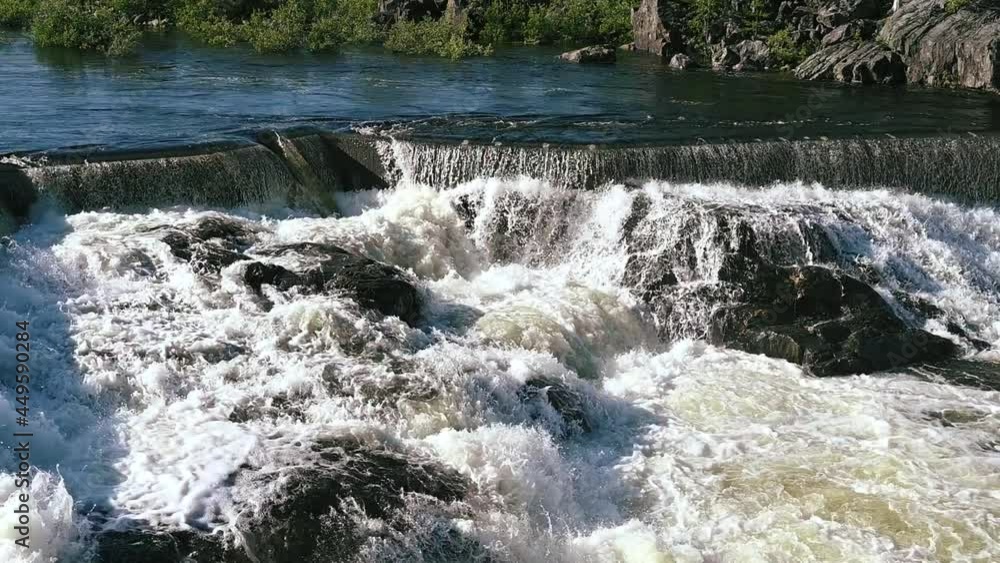 Hydroelectric dam with flowing water. Fairy waterfall at wild forest ...