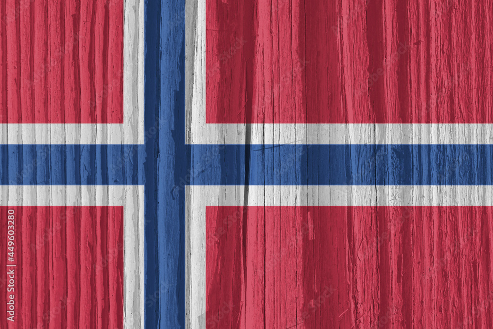 The flag of Norway on a dry wooden surface, cracked with age. It seems ...