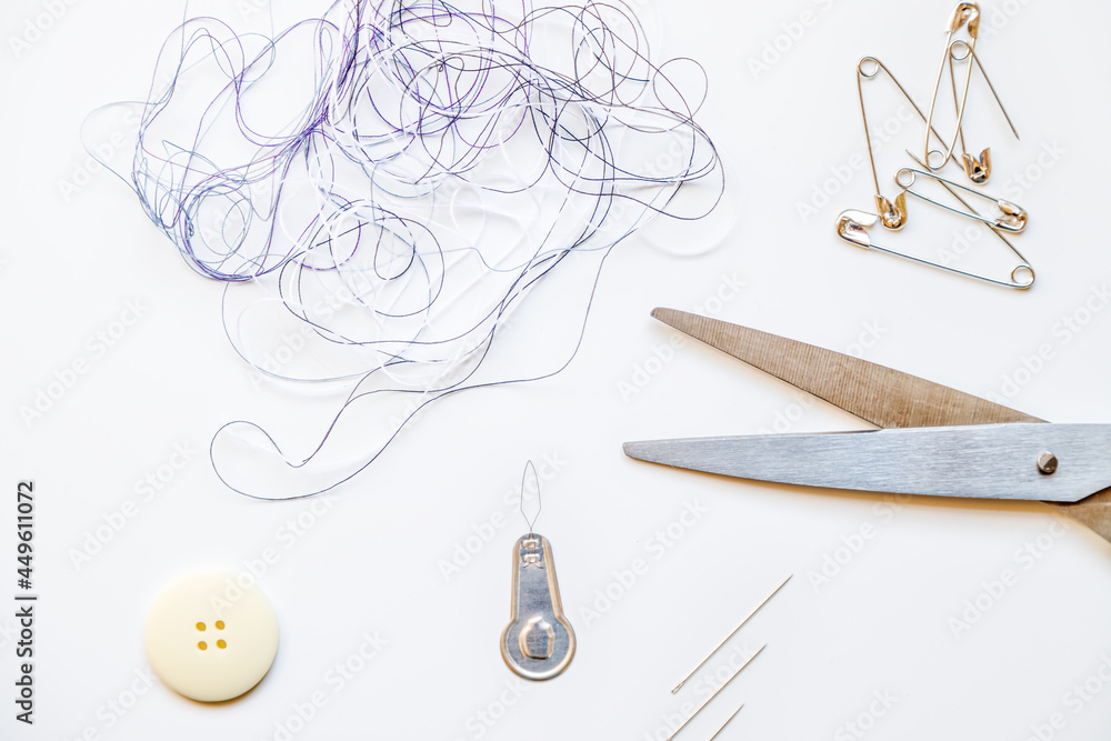 Tangled threads, needles, threading, safety pins and scissors mockup ...