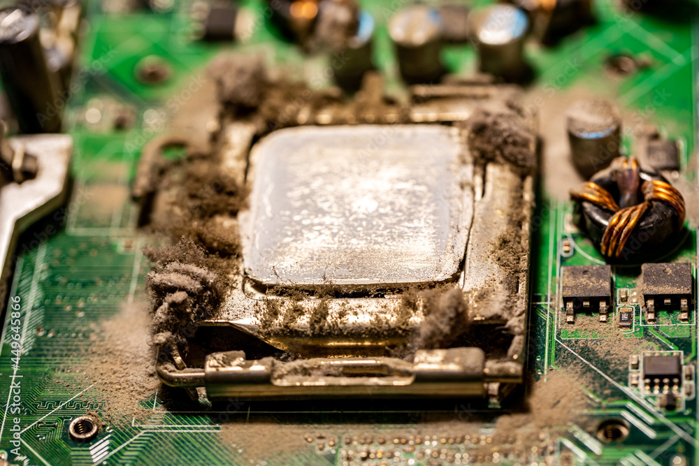 Old socket with CPU processor and dried thermal paste close-up, dust ...
