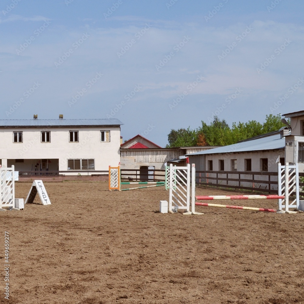 empty show jumping arena with obstacles and start mark , barriers and ...