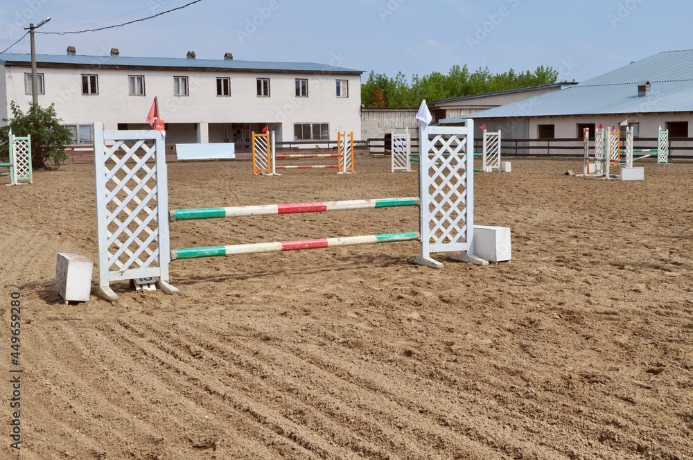 empty show jumping arena with obstacles, barriers and poles, horse ...