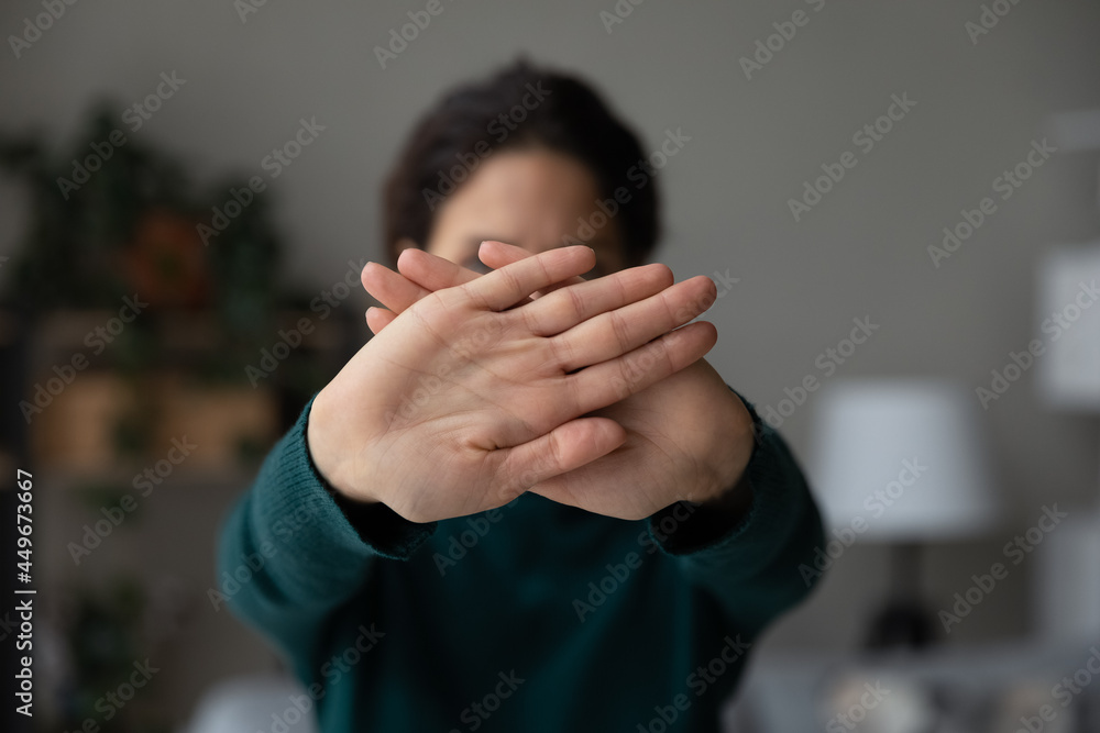 Close up woman showing stop gesture or defense sign, saying no ...