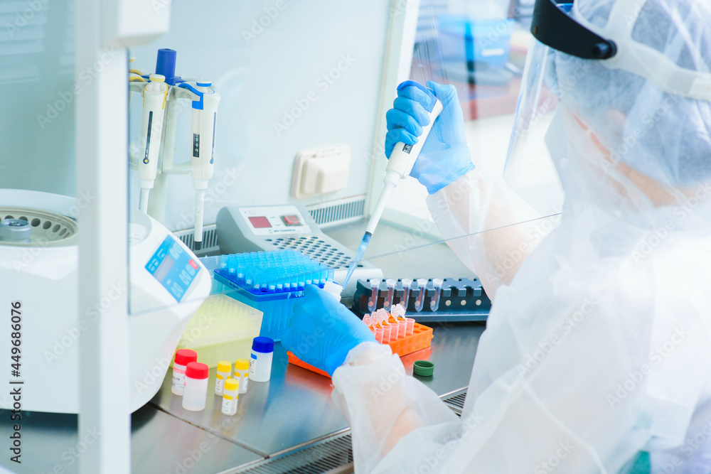 a PCR lab worker creates a vaccine against covid-19 coronavirus ...