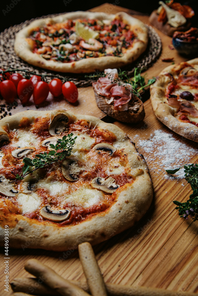 pizza on a wooden table napoletana pizzeria bruschetta meal table Stock ...