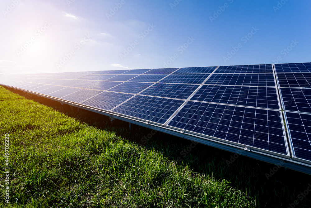 Photovoltaic solar panels on blue sky background Stock Photo | Adobe Stock