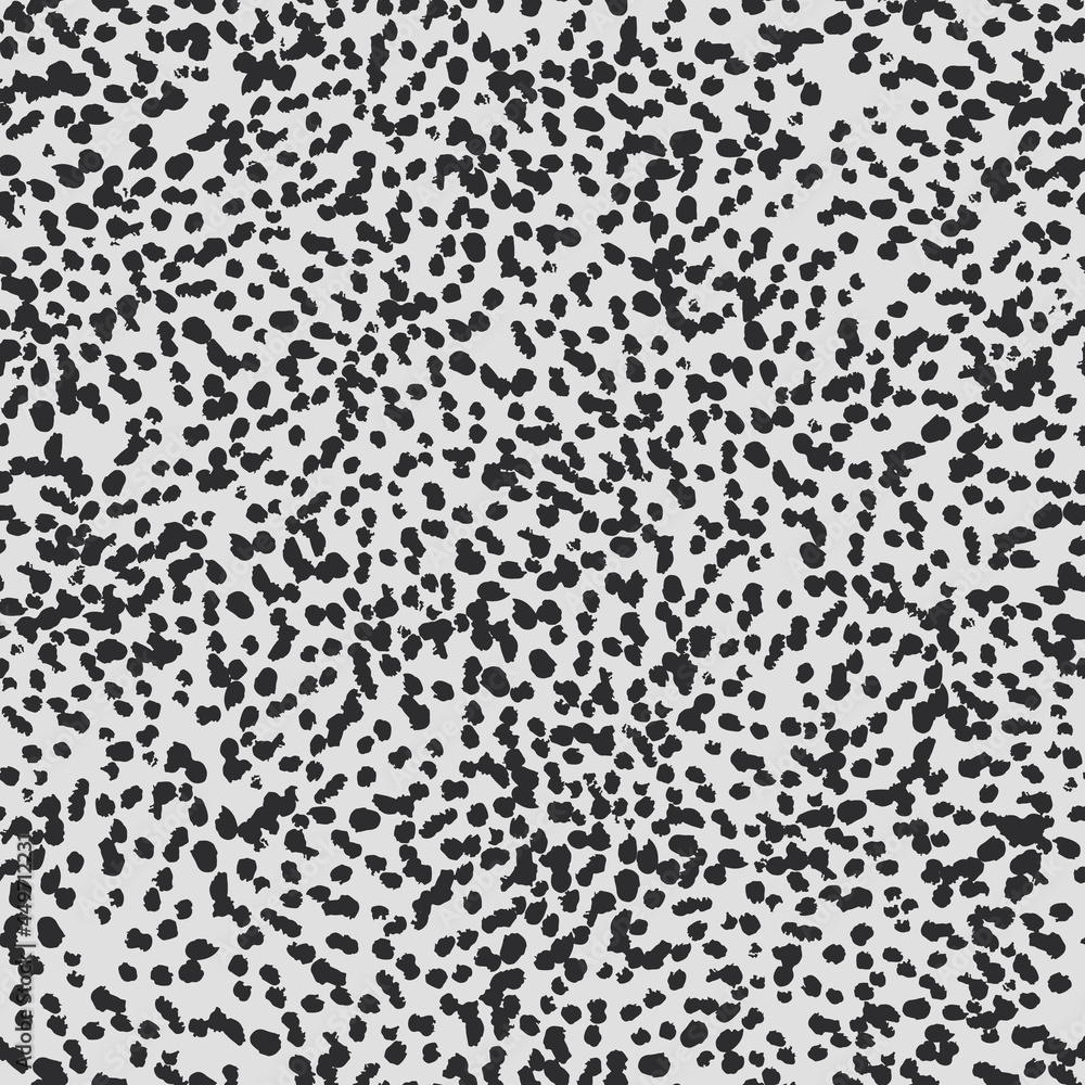 Animal print seamless pattern design with small black spots on light ...