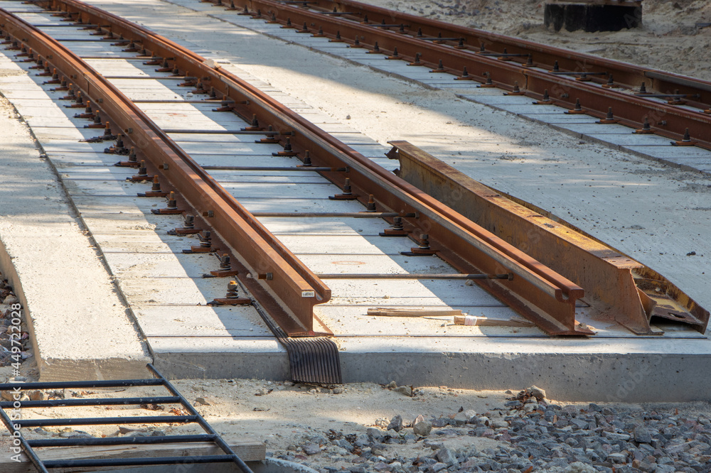Repair of two-way tram tracks, laying of iron rails on reinforced ...