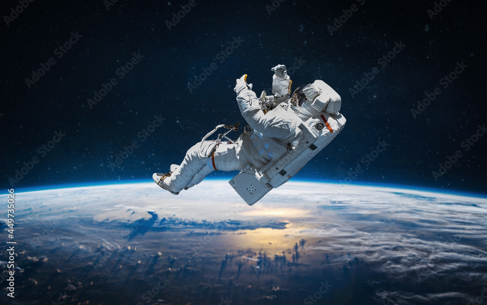 Astronaut on orbit of Earth. Planet Earth. Sky and clouds. Stratosphere ...