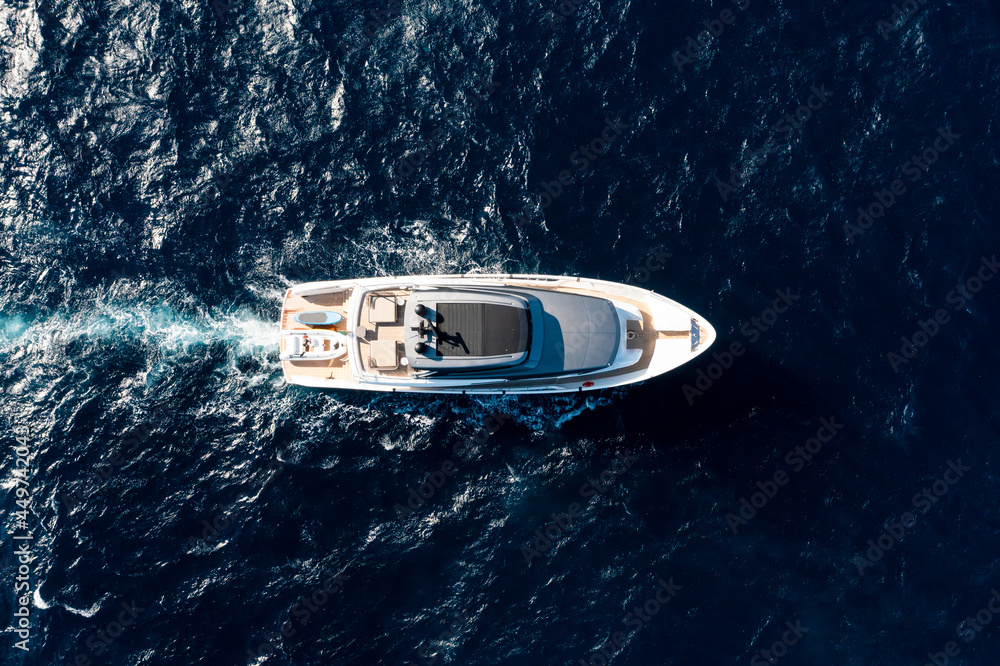 View from above, stunning aerial view of a luxury yacht cruising on a ...