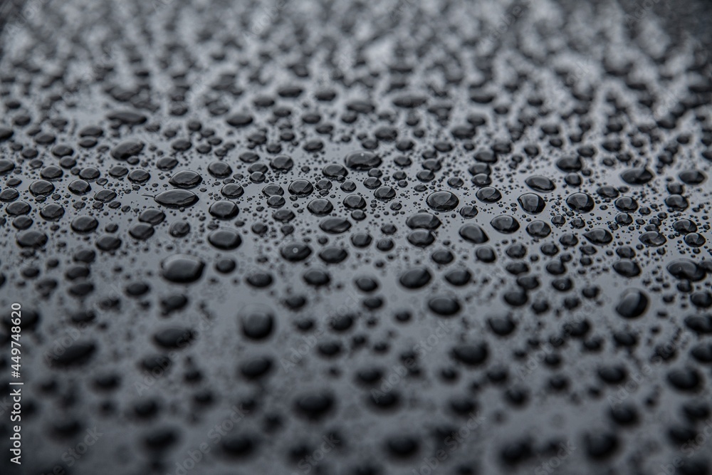 Wet metal surface after rain. Hydrophobic effect and water drops on car ...