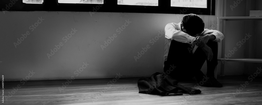 black and white tone of man lose a job sitting in room, dark sad and ...