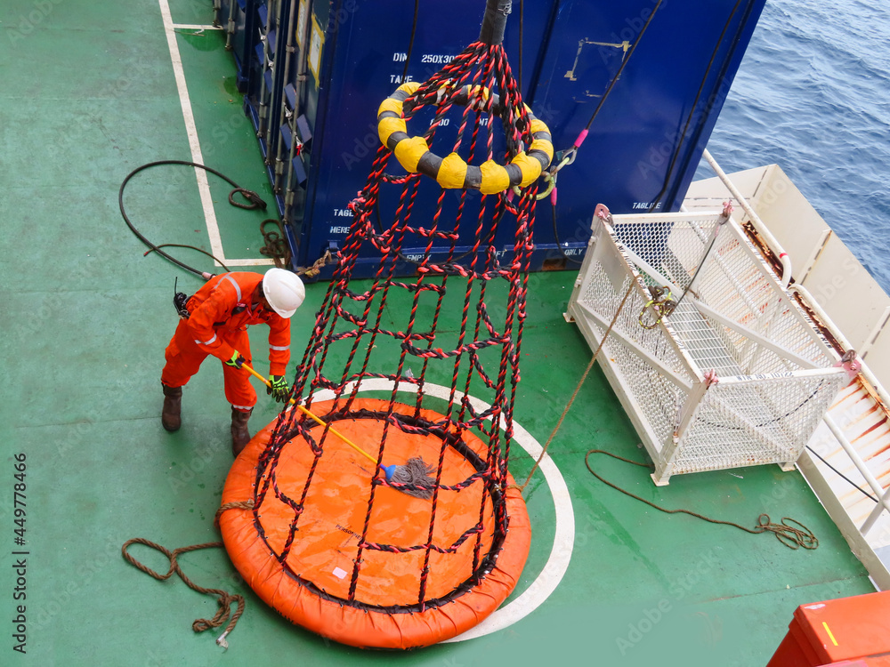 Workers is cleaning the personal basket for lifting the worker by the ...