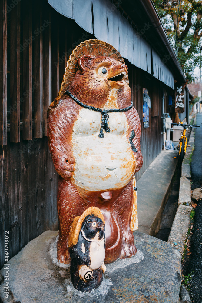 Japanese raccoon dog Tanuki ceramic Mascot at Japan shop front ...