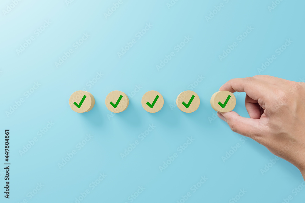 Checklist and check mark concept. Check mark on wooden blocks on light ...