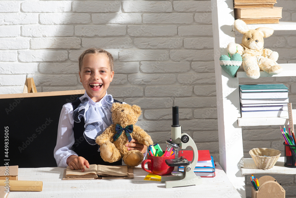 Cute lovely school childr girl wearing school uniform study hold toy ...