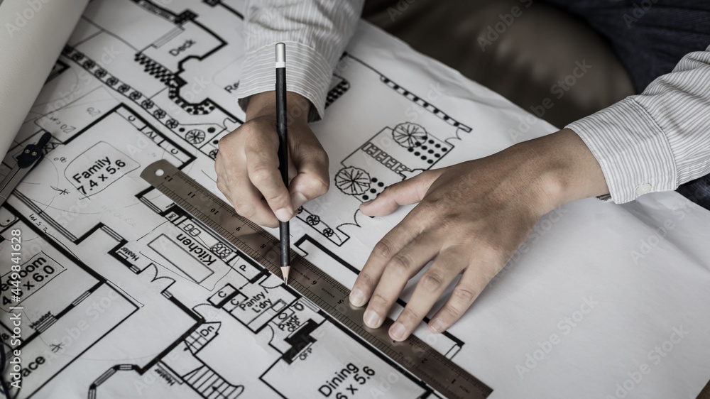 Poster Engineer and Architect concept, Man uses a ruler to measure the ...