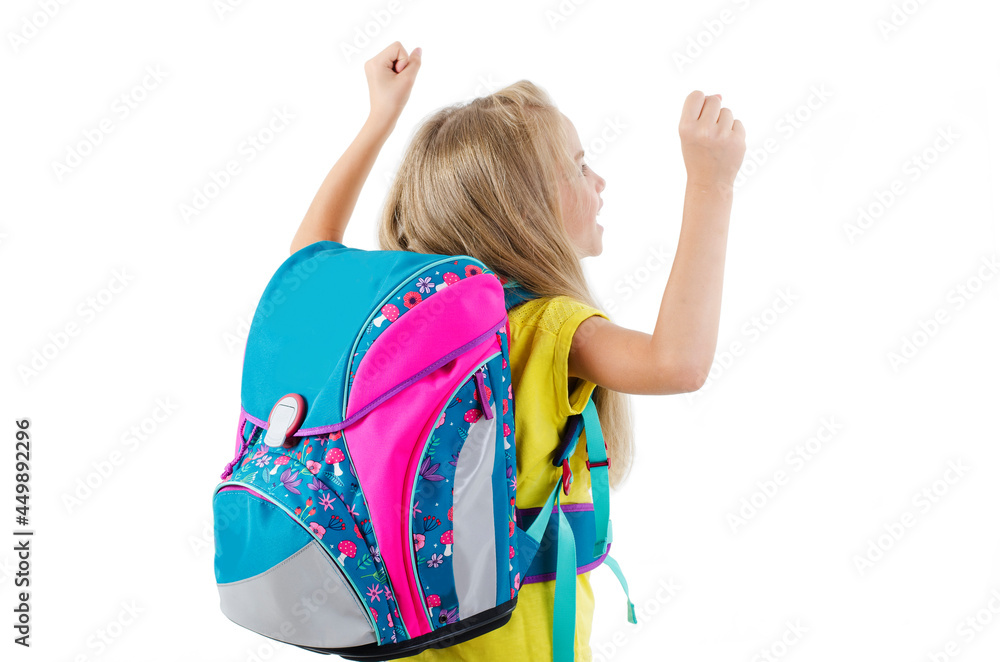 Beautiful schoolgirl with backpacks looking at wall, happy. Cheering ...