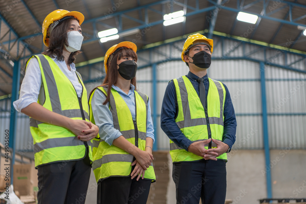 Group of Asian male and female engineers wearing hygienic mask protect ...
