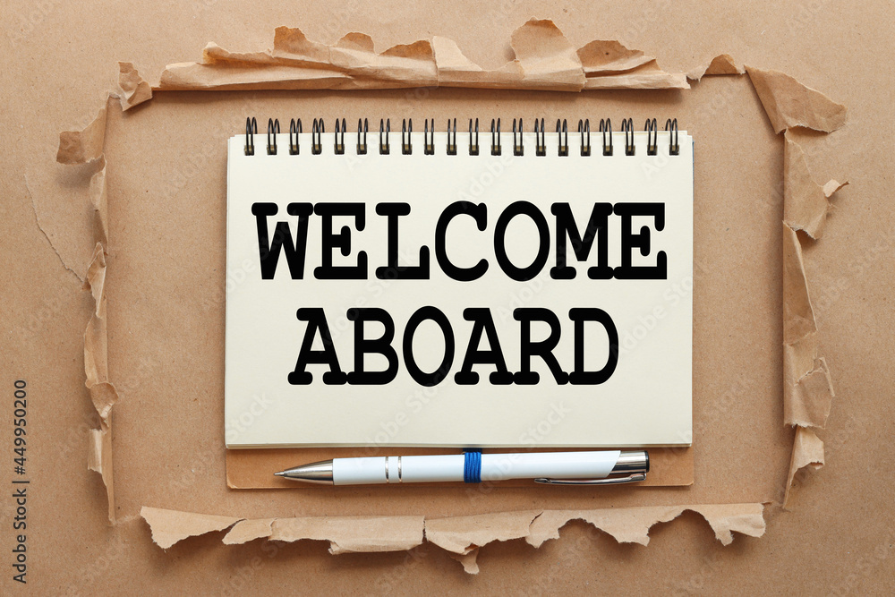 Welcome Aboard. text on notepad near torn paper Stock Photo | Adobe Stock