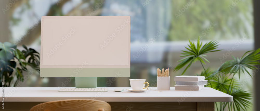 Workspace with natural greenery view outdoor through wide window ...