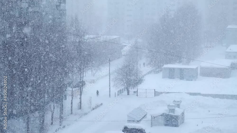 Urban landscape in blue colors with heavy snowfall on the street ...