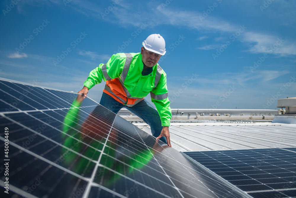 Engineer wearing unifrom and helmet inspect and check solar cell panel ...