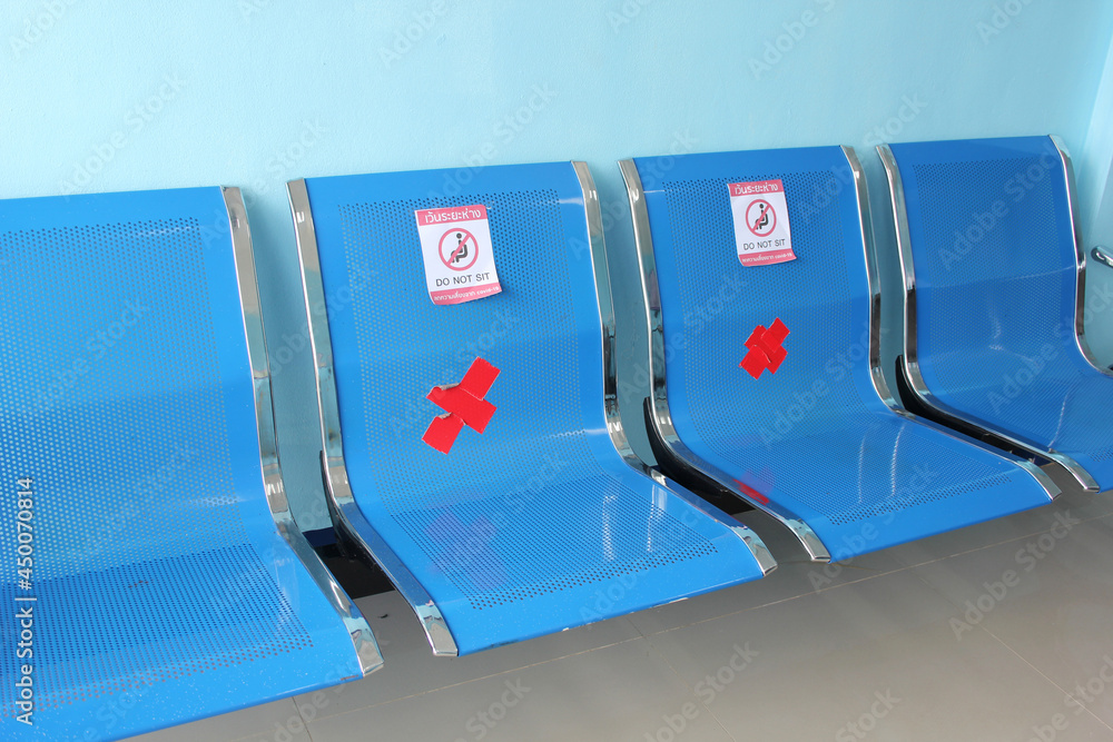 Blue rows of seats with signs - Do not sit, do not sit. social distance ...