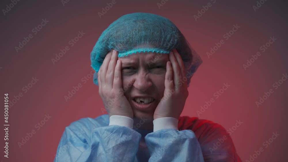 Portrait of bruised woman in medical clothes with beatings on her face ...