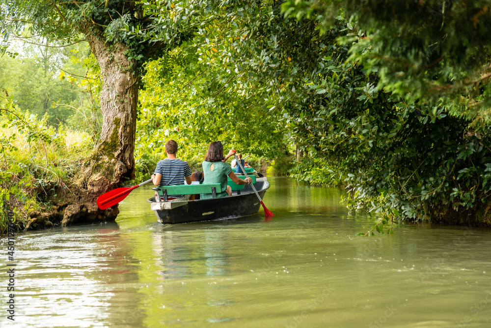 A young couple rowing the boat sailing between La Garette and Coulon ...
