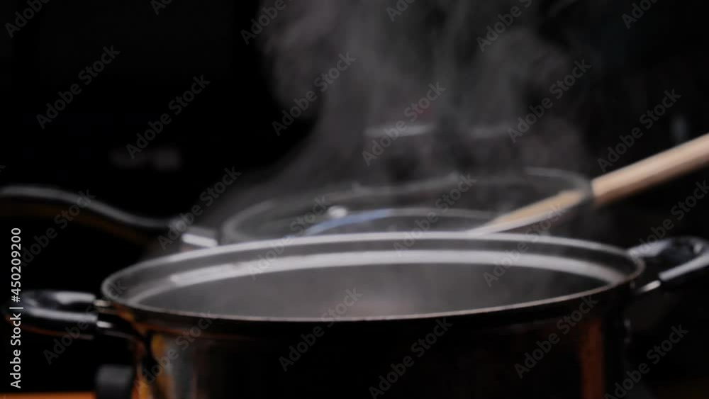 Cassava is being boiled in a pot of boiling water to making Thai ...