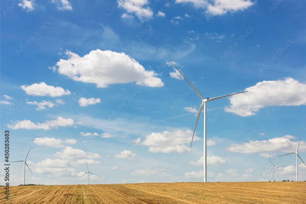 Panoramic landscape view of new white modern wind turbine farm power ...
