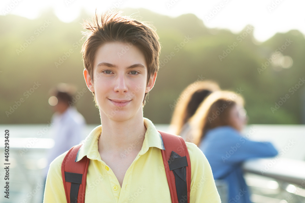 Young handsome 15 years old teen boy looking at camera and happy ...