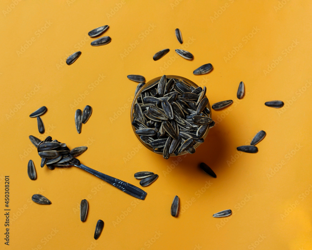 Kuaci made of sunflower seeds isolated on yellow background. How to ...