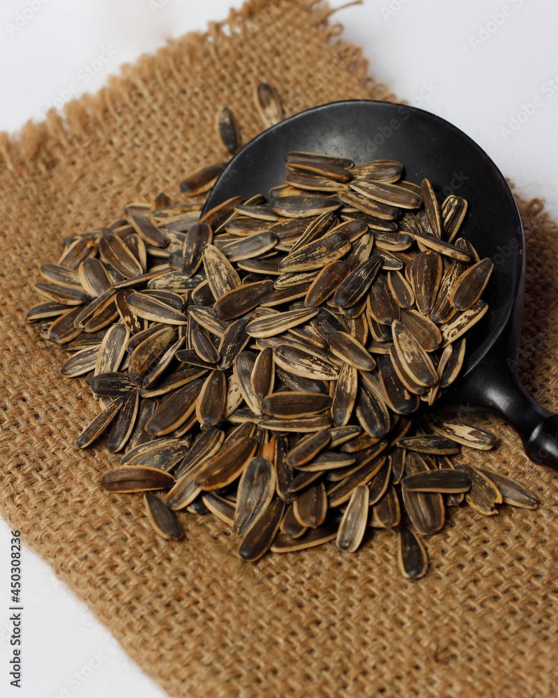 Kuaci made of sun seeds isolated on bright background. How to process ...