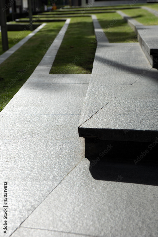 Neat and tidy grey stair steps made of stone and granite tiles with a ...
