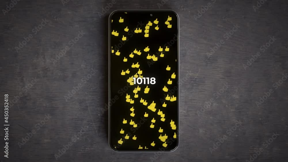 Vidéo Stock Smartphone on a desk showing social media like counter with ...