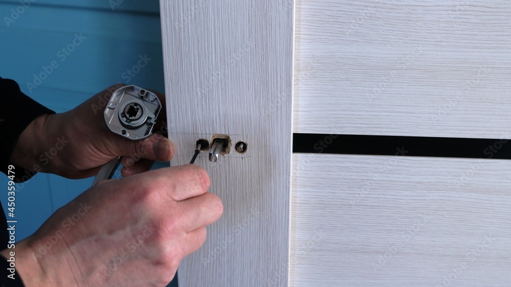 installation of the door handle and fixing the fasteners in the ...