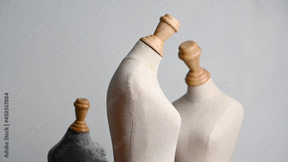 close up of a fabric and wood vintage dummy dress mannequin standing ...