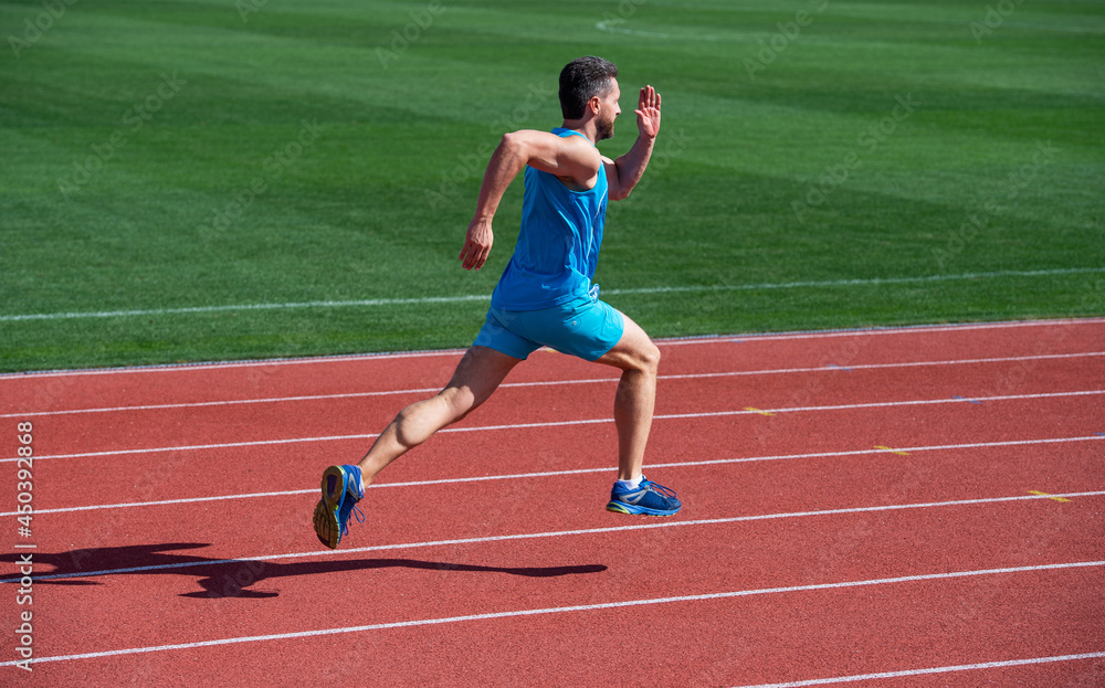 athletic muscular man runner running on stadium, energy Stock Photo ...