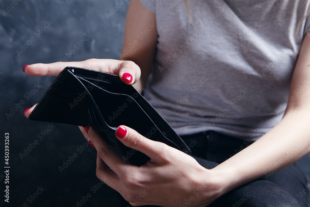 young girl showing empty wallet Stock Photo | Adobe Stock