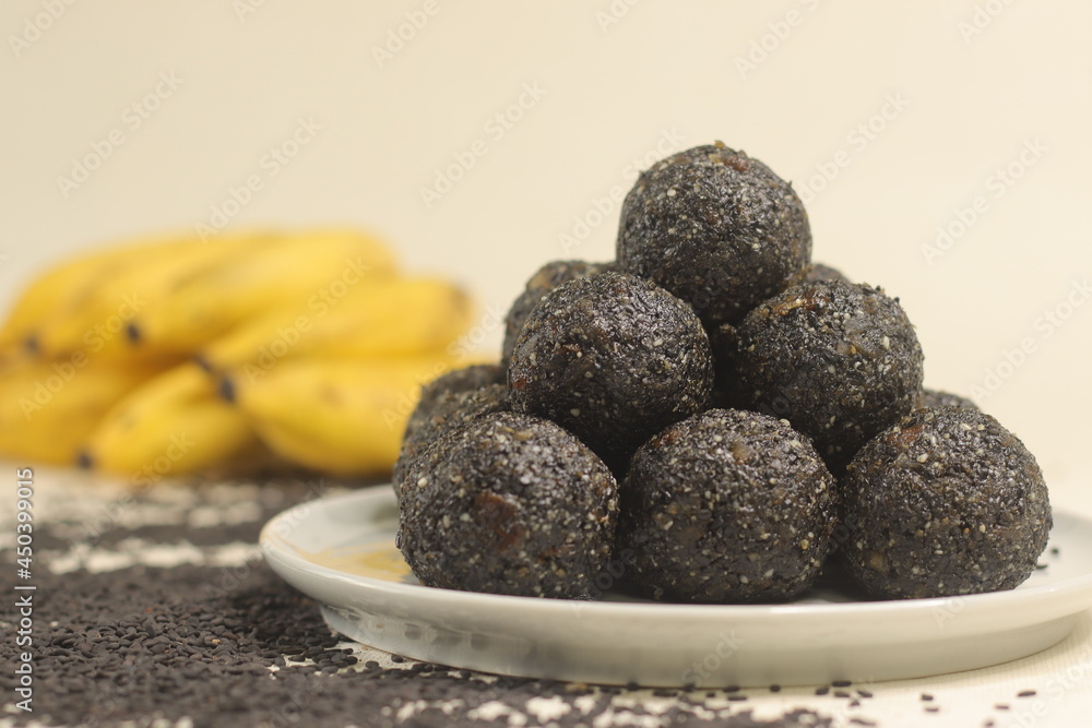Traditional Indian sweet balls made with sesame seeds, jaggery and ...