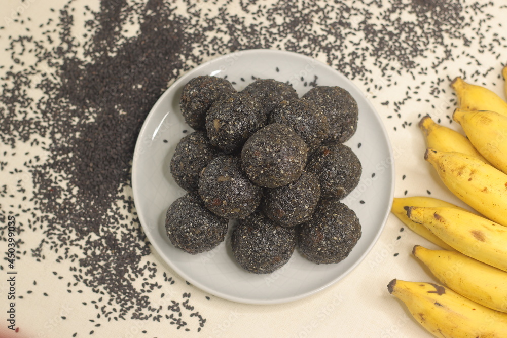 Traditional Indian sweet balls made with sesame seeds, jaggery and ...