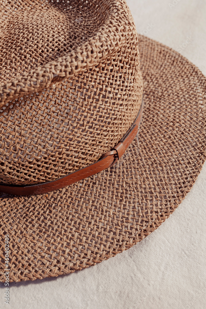 Straw hat on a wooden table Stock Photo | Adobe Stock