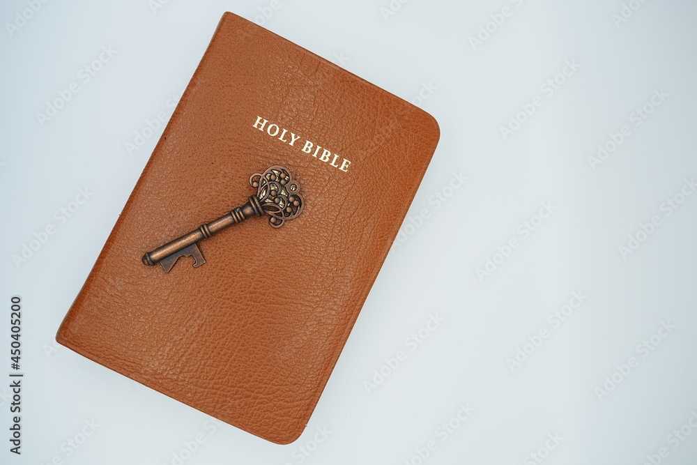 Key on bible on white background. Bible is key of success life, unlock ...