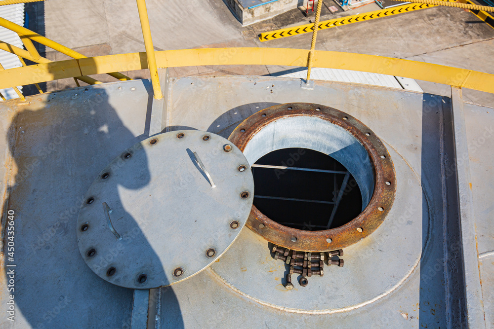 Opened rusty manhole on roof storage tank confined space Stock Photo ...