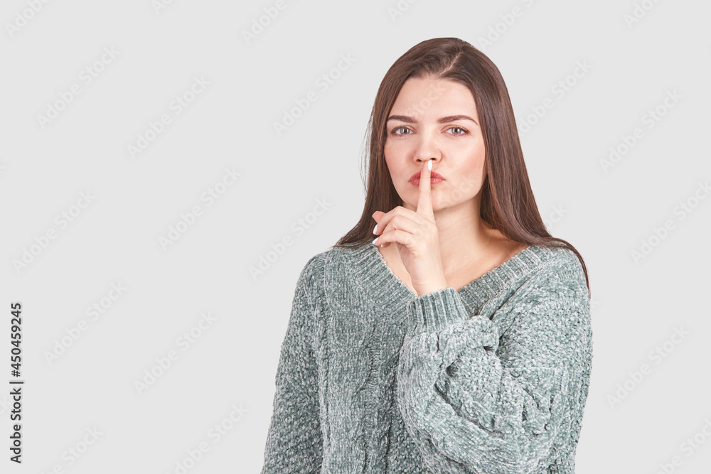 Pretty young woman gesture. Studio portrait. Female person. Home grey ...